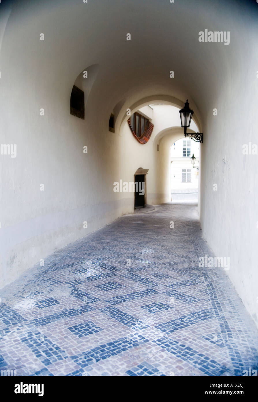 Arched hallway in old convent in Prague, Czech Republic with blue and ...
