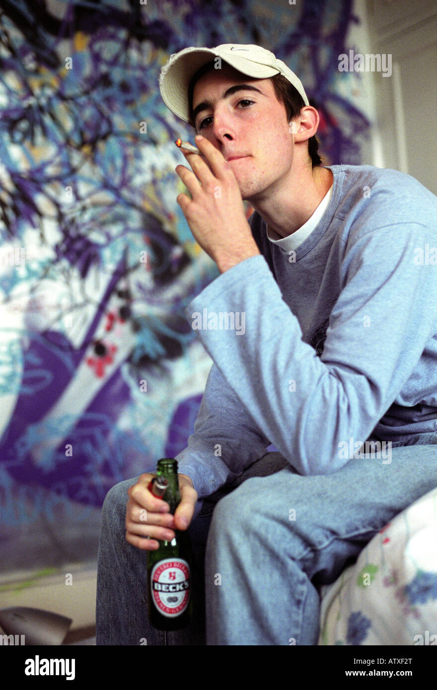 Teenager smoking a spliff and drinking beer Stock Photo - Alamy