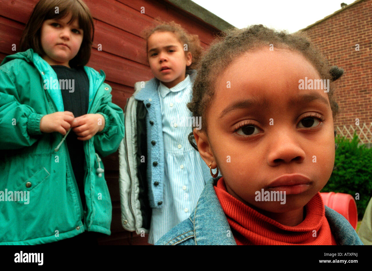 Primary age children in school yard Stock Photo - Alamy