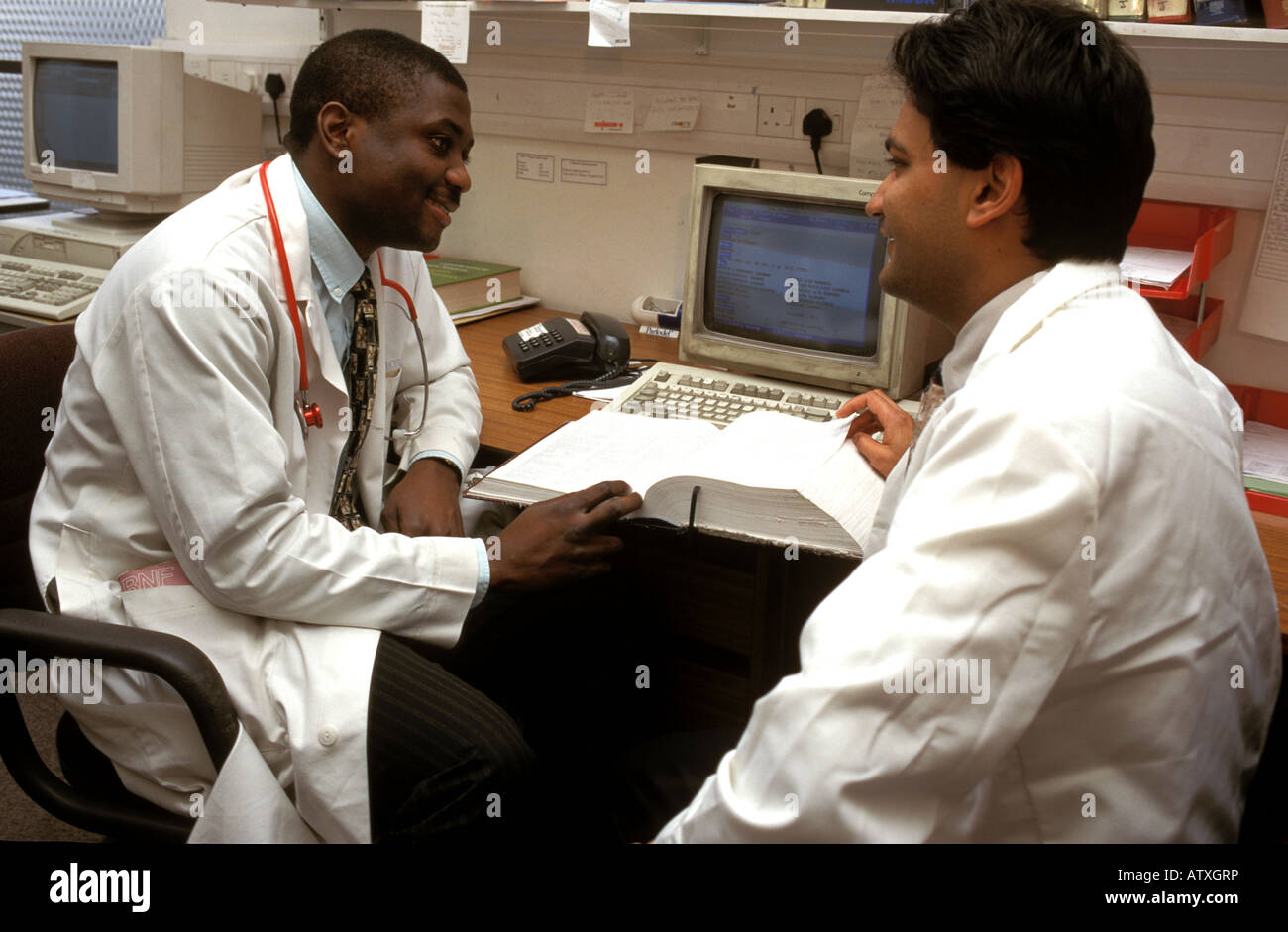 Doctor and asian patient uk hi-res stock photography and images - Alamy