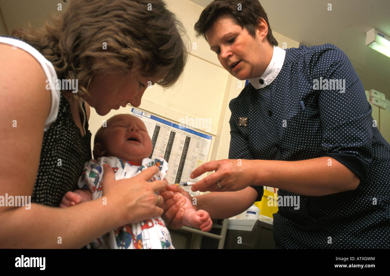 Nurse giving young baby his vaccination Stock Photo - Alamy