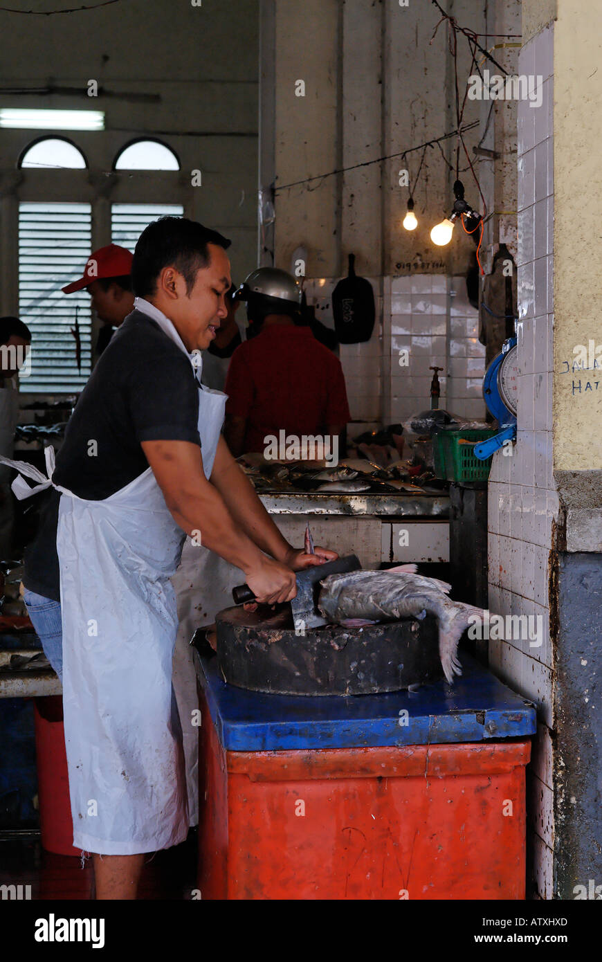 A fish monger in Kuching Stock Photo - Alamy