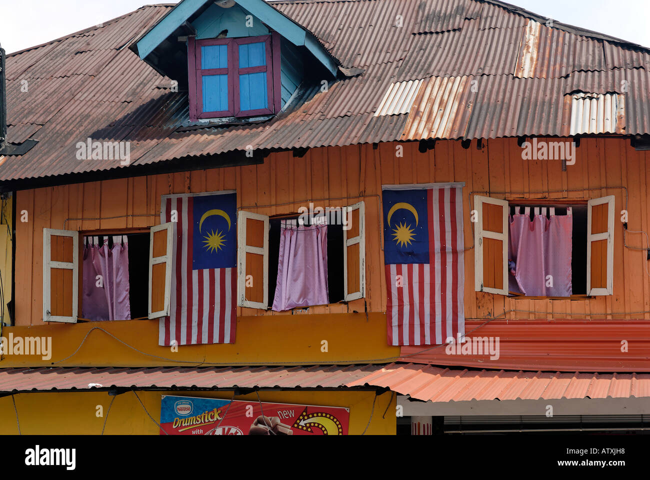 Malaysian Flags adorn a house during Merdeka celebrations in Kuching ...