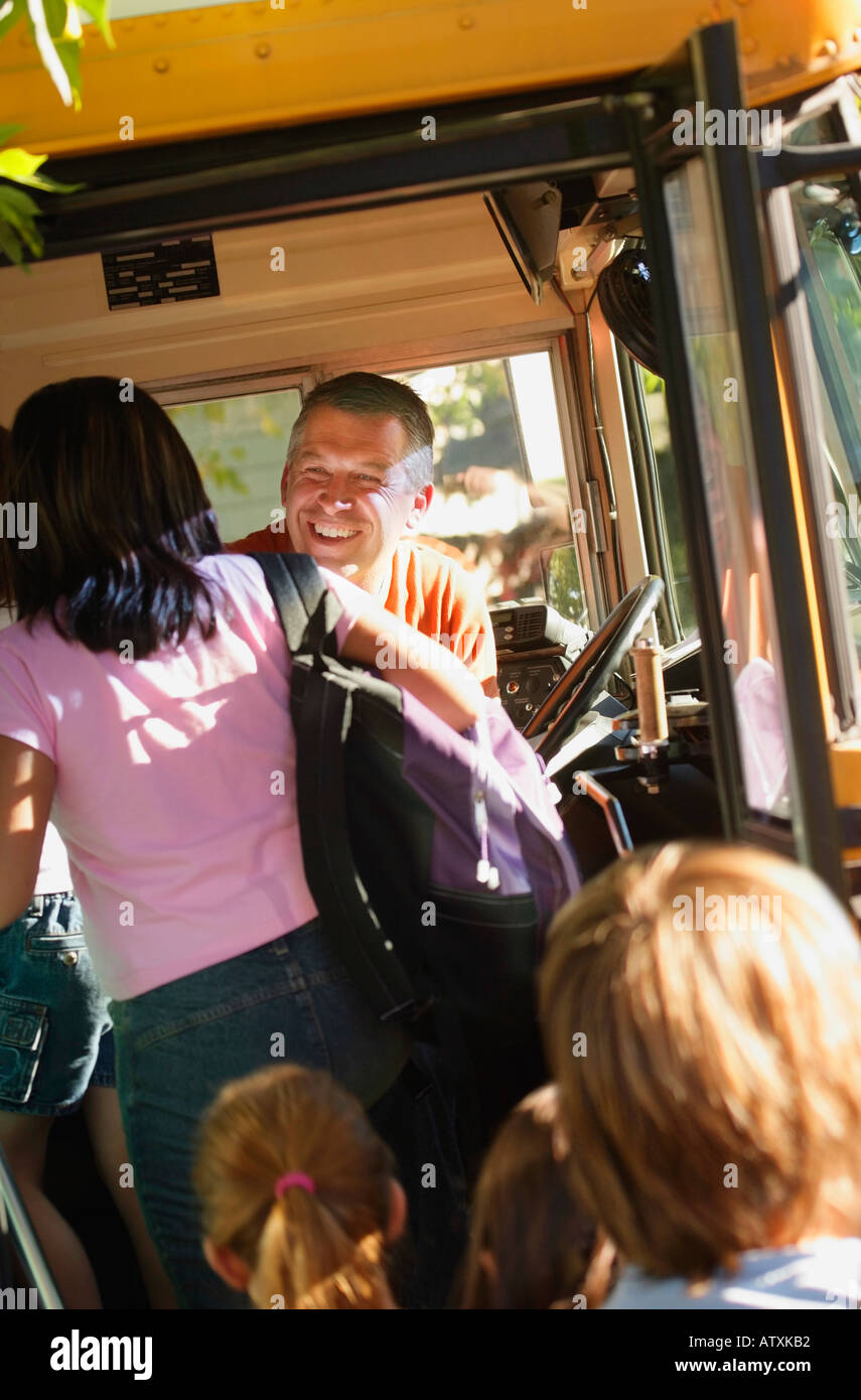 Children board a school bus Stock Photo - Alamy