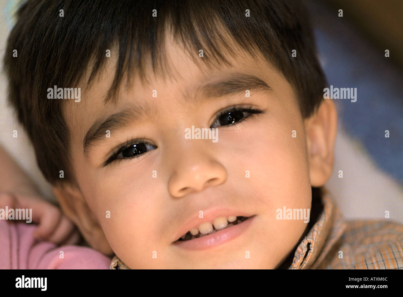 Young child looking into camera Stock Photo - Alamy