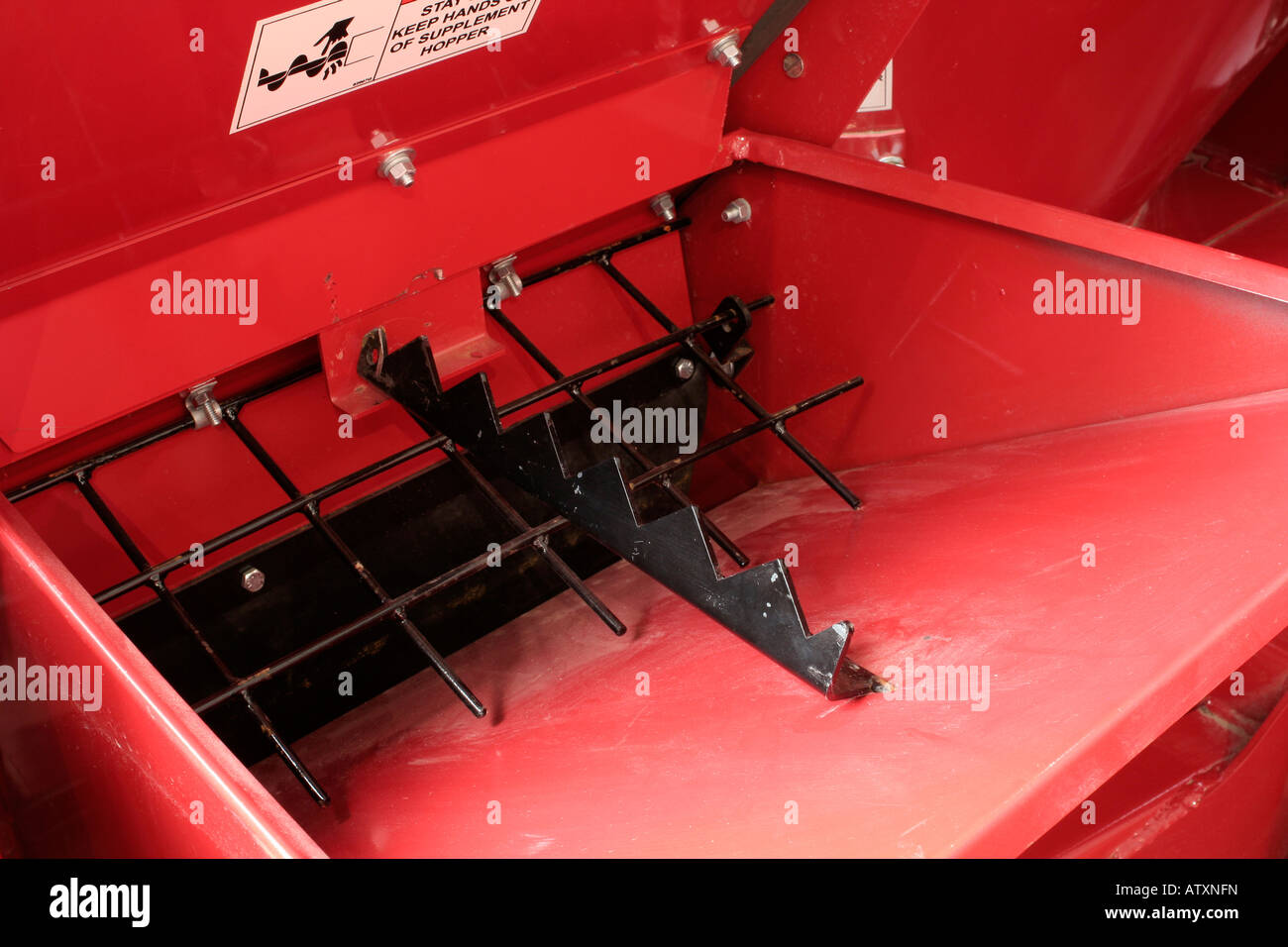 Hammermill feed hopper Stock Photo - Alamy