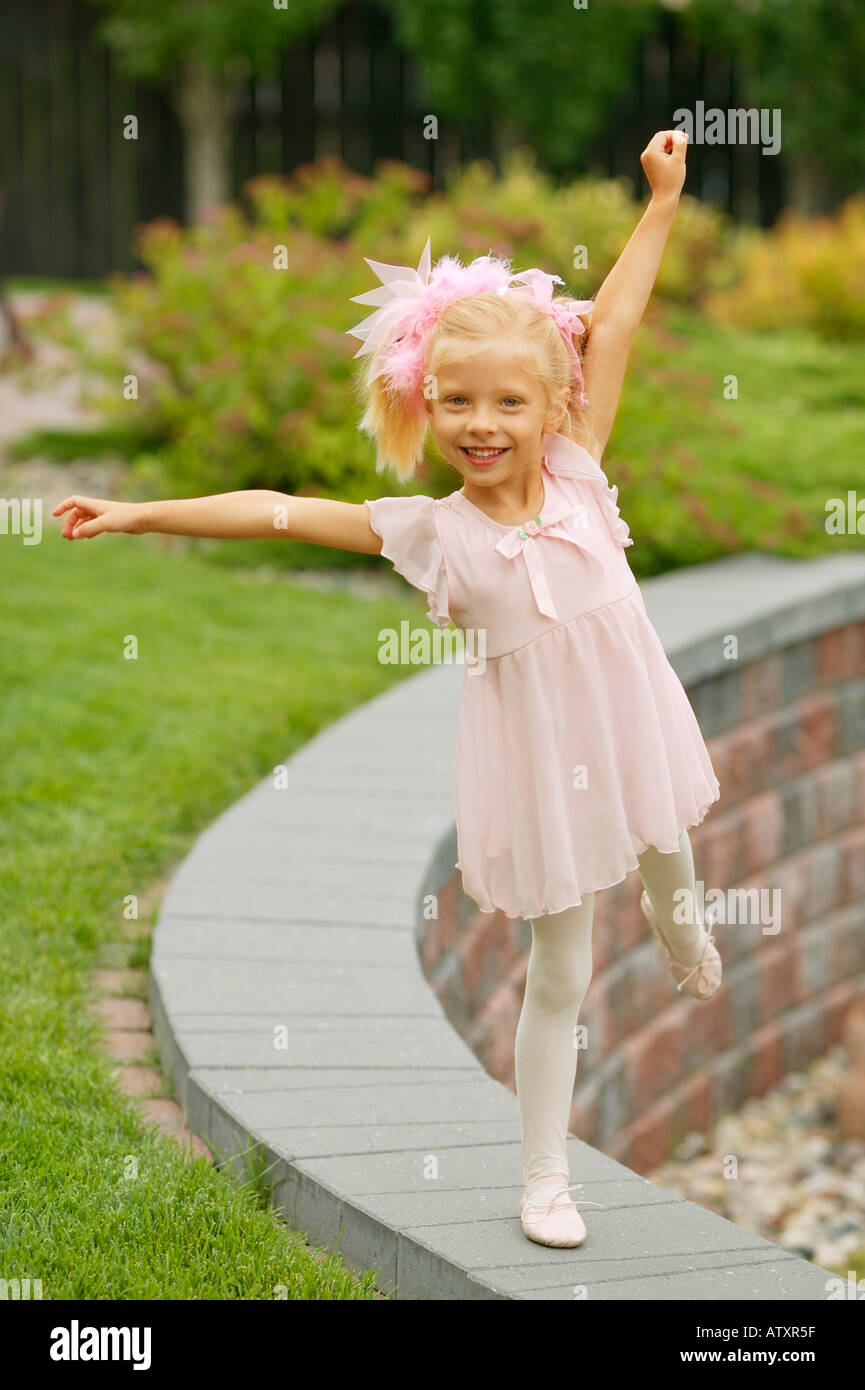 Child dances on ledge Stock Photo - Alamy