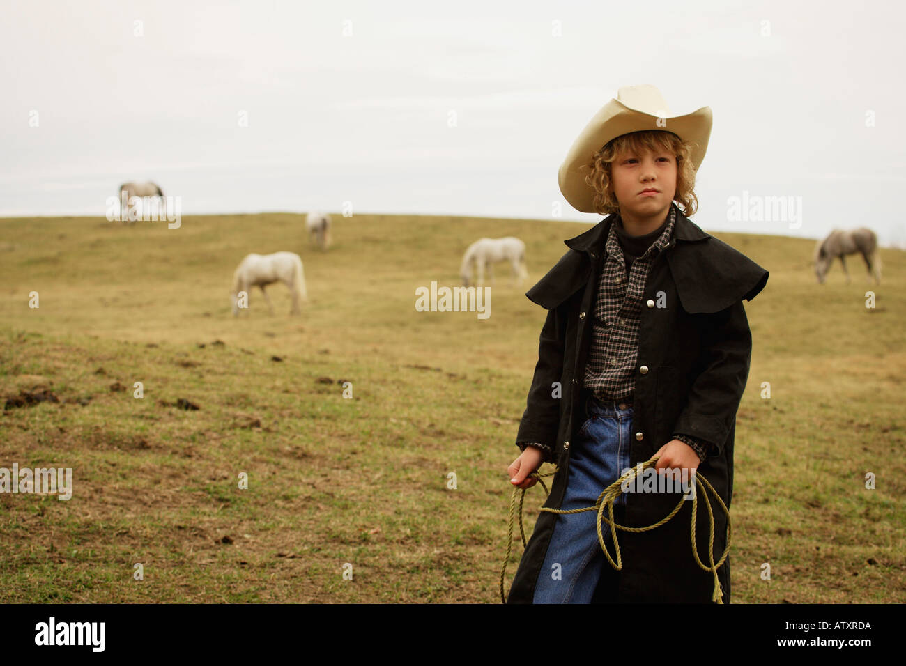 Young boy with lasso Stock Photo - Alamy