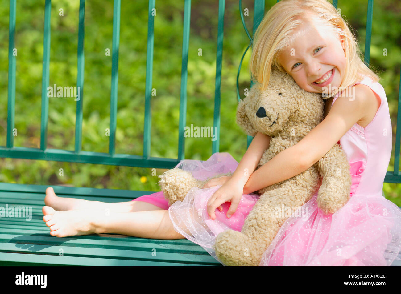 Girl hugs teddy bear Stock Photo - Alamy