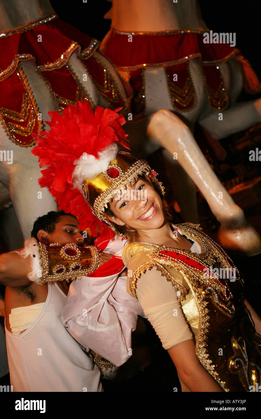 Close portrait of smiling lady carnival dancer getting dressed into red ...