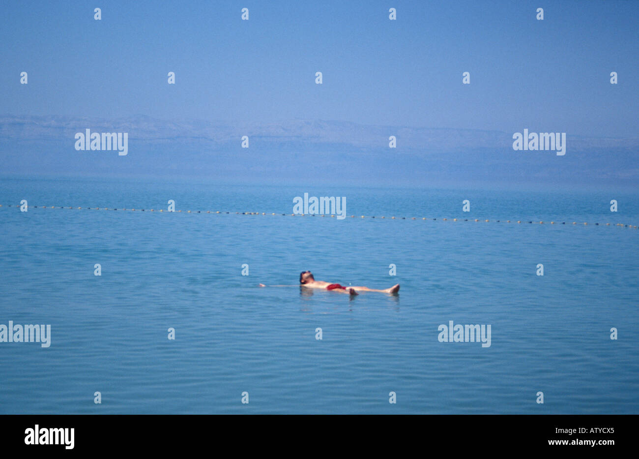 Dead sea man floating at the dead sea hi-res stock photography and ...