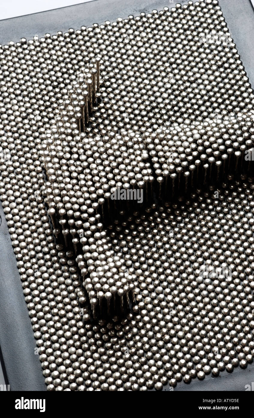 Pin Matrix with claw hammer imprint Stock Photo - Alamy