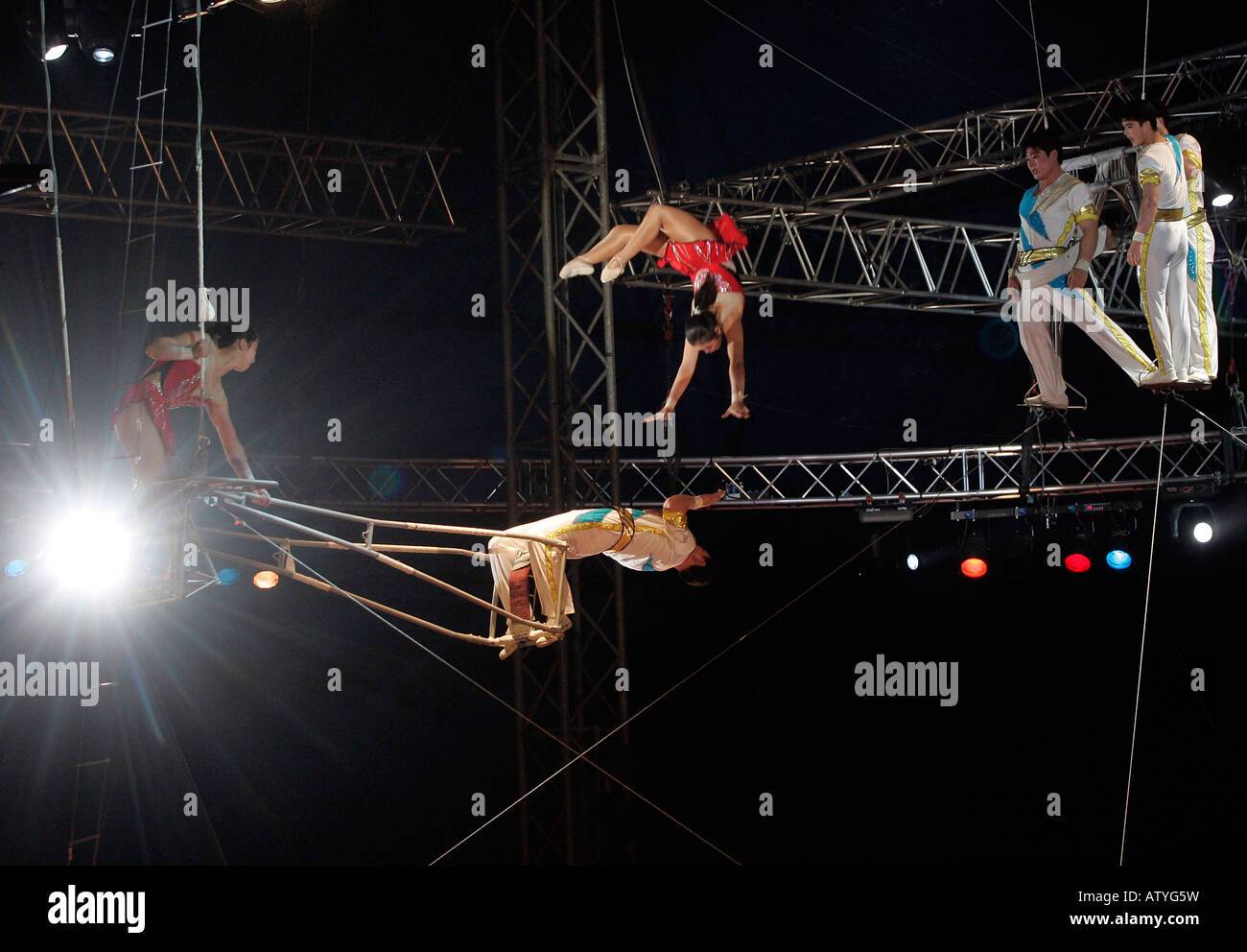 five korean artists at the trapezoid in circus Stock Photo - Alamy