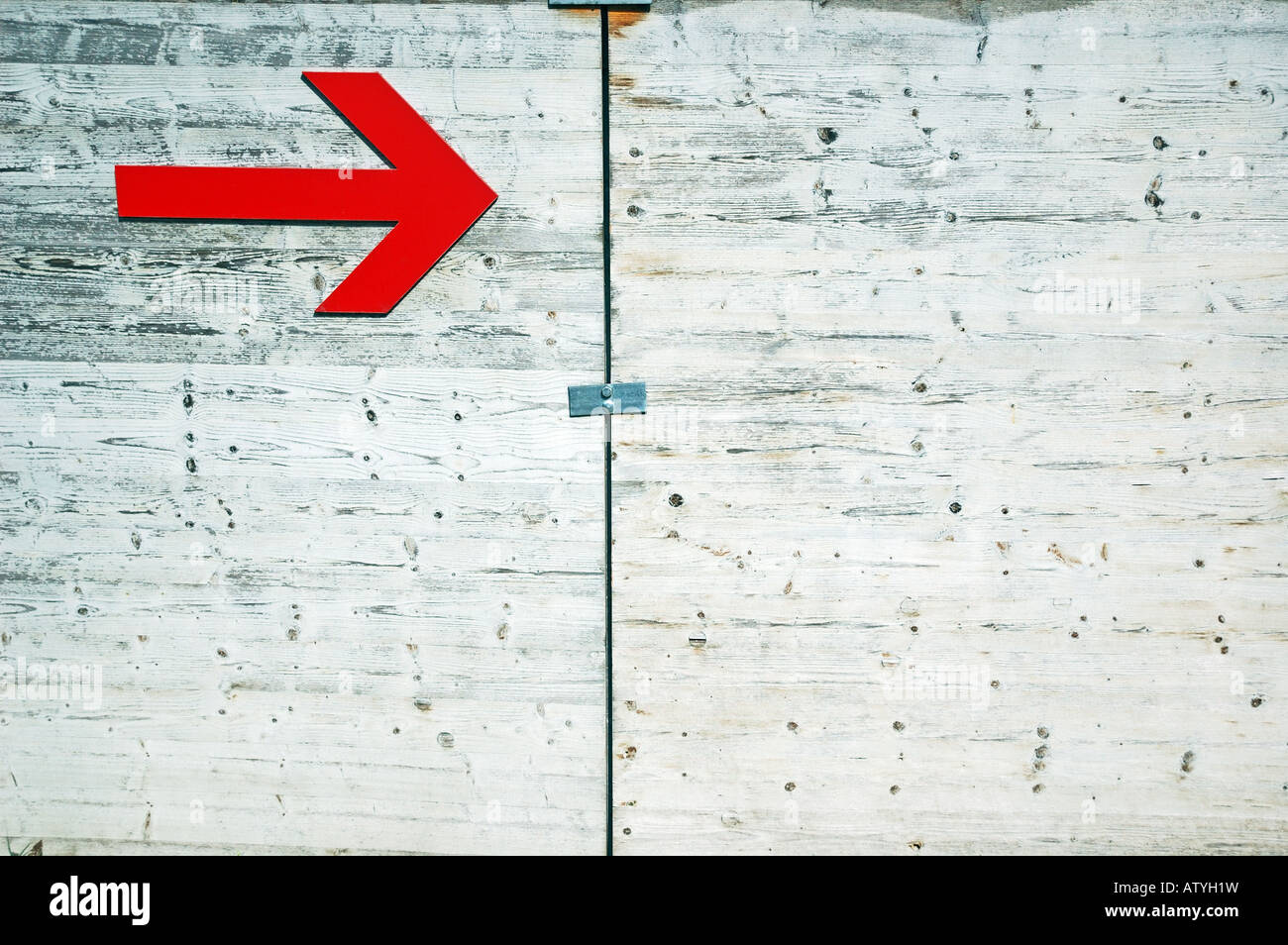 Red arrow sign board sideways wall hi-res stock photography and images ...