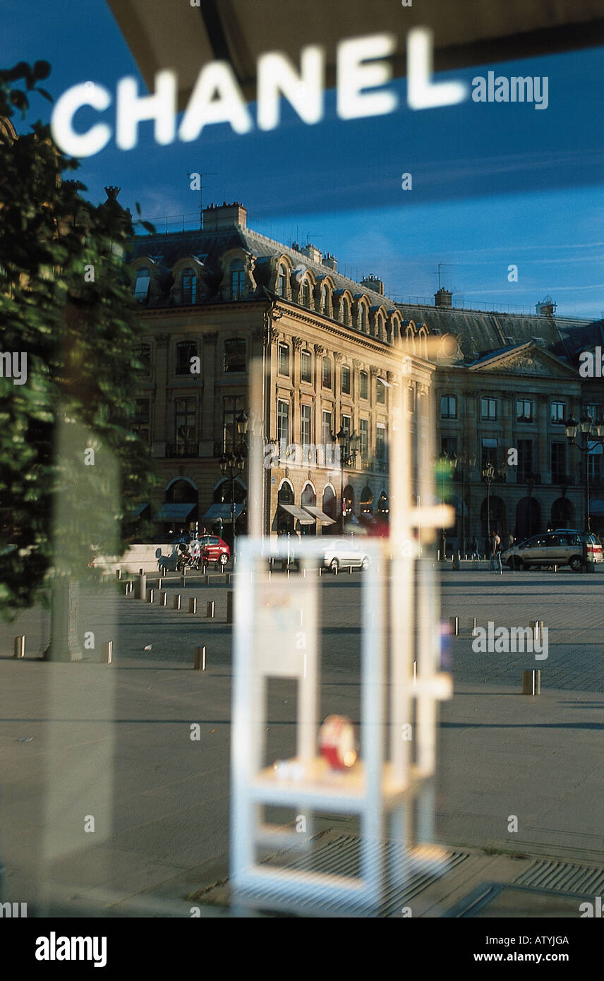 Building reflected in Chanel Boutique shop window in Paris Stock Photo ...