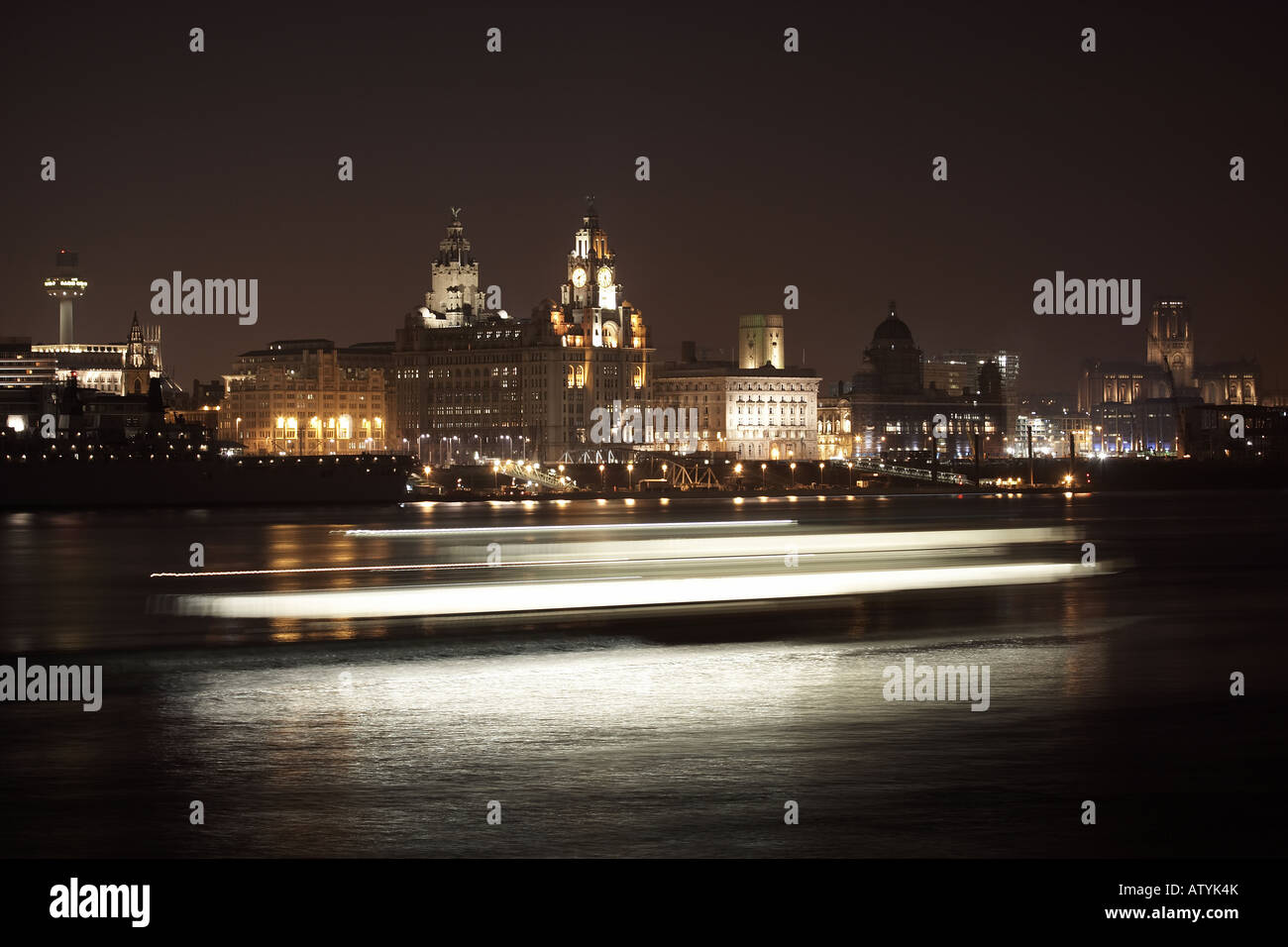 Liverpool skyline at night has seen from over the River Mersey with the ...