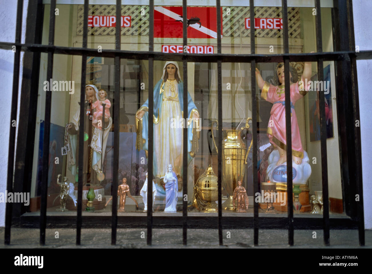 Store window display with Christian religious items in Cartagena ...