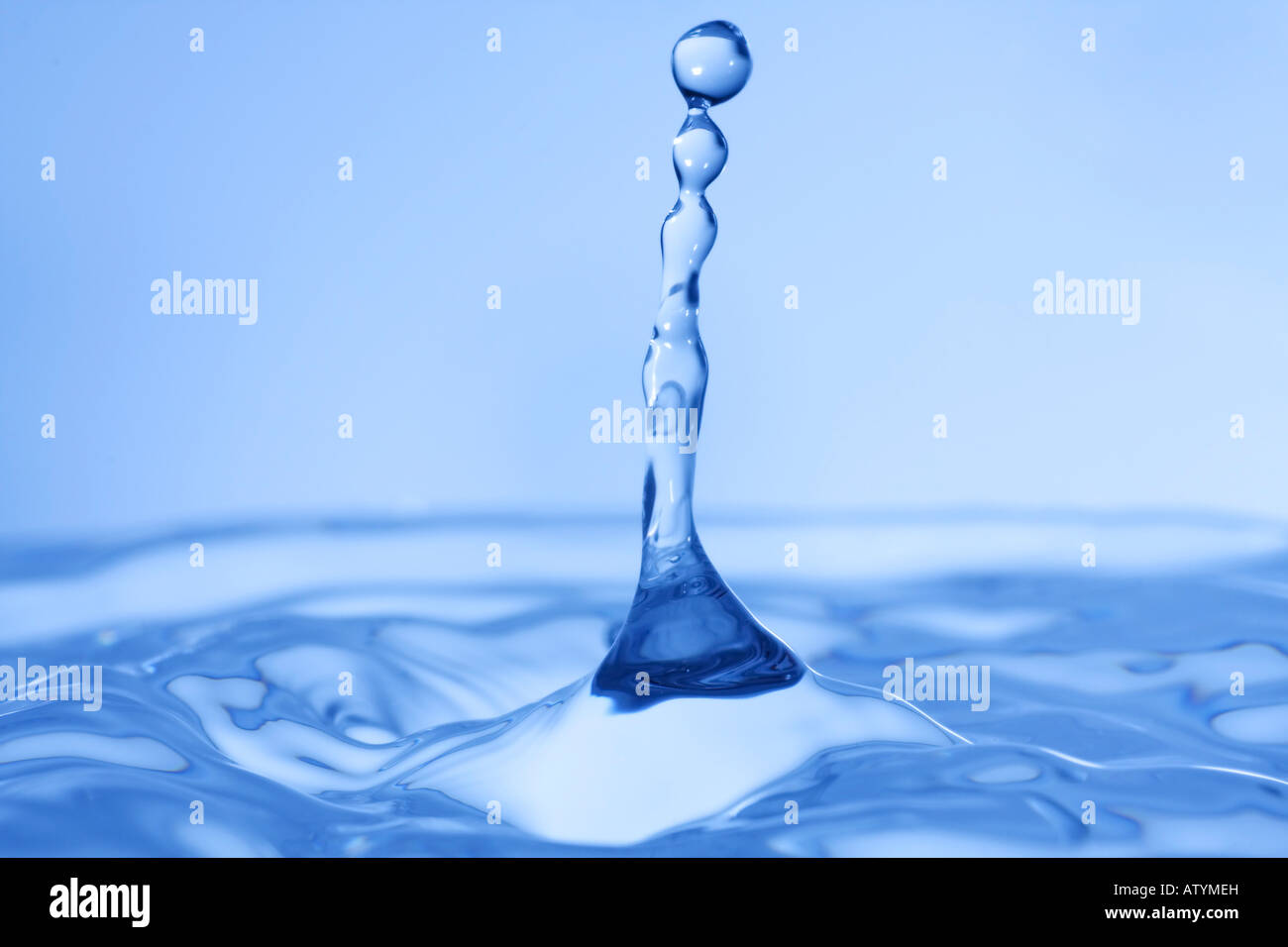 water droplet rebounding on the surface Stock Photo - Alamy