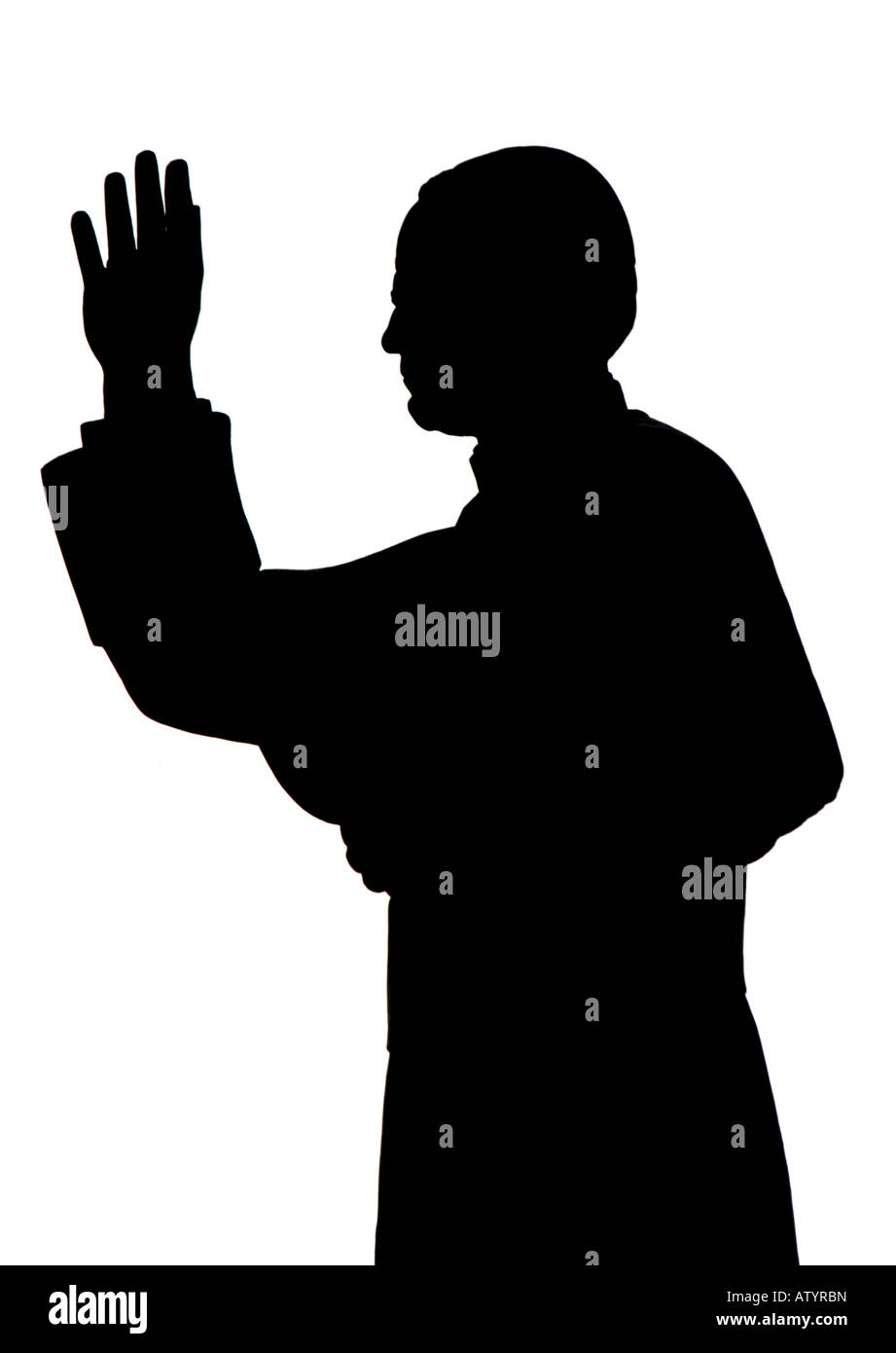 Silhouette of a man holding up his hand Stock Photo - Alamy