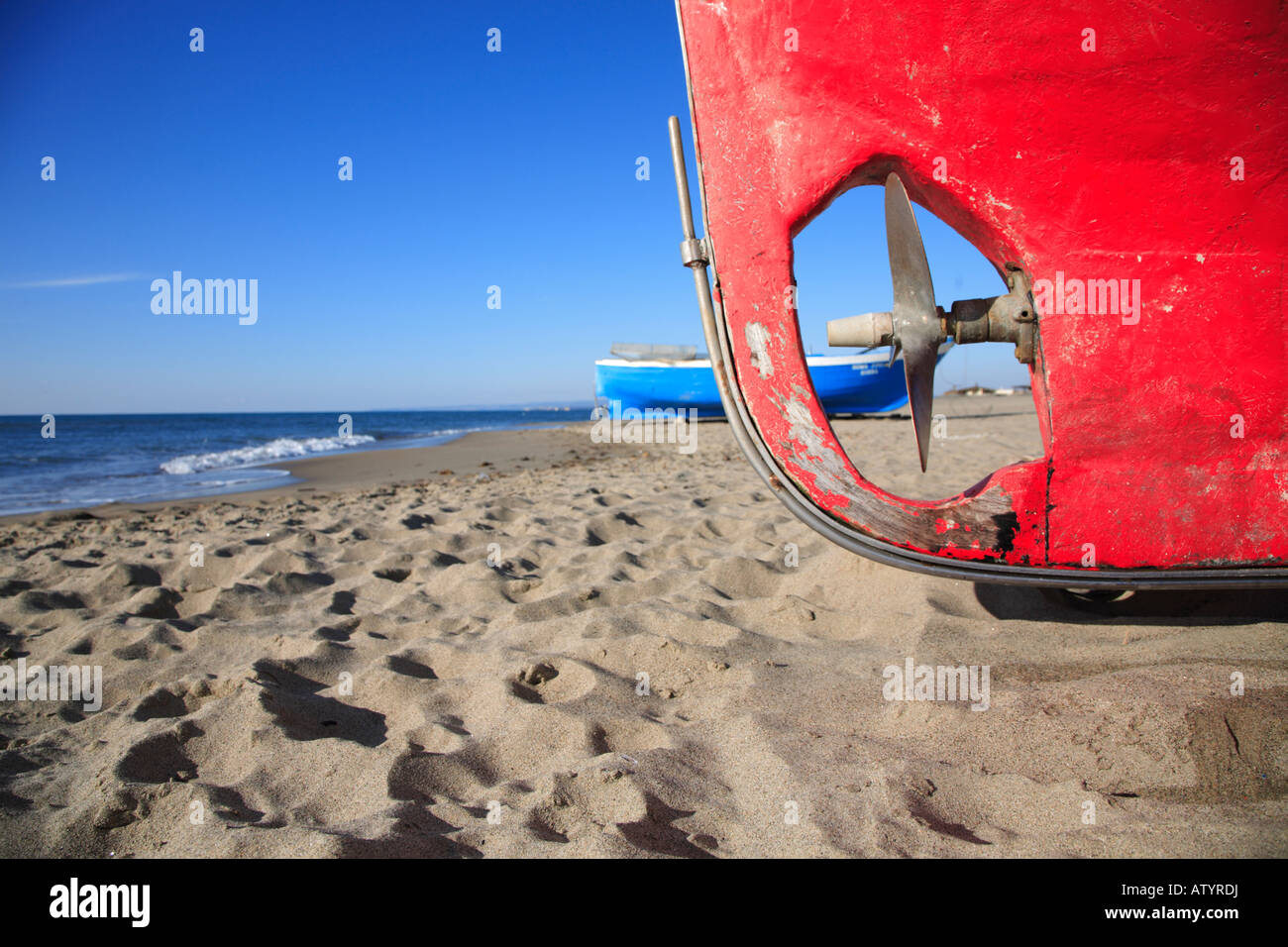 small fishing boat used to catch shellfish pulled up on beach Stock ...