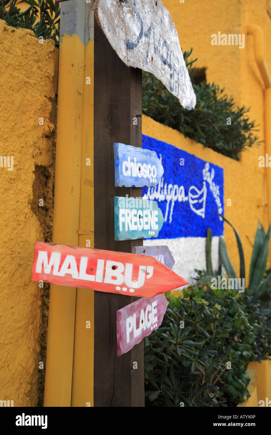 Home made painted direction signs on pole pointing to Malibù and ...