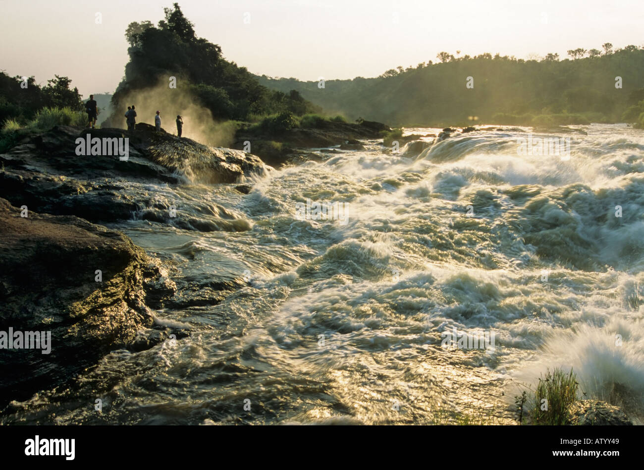Tourists enjoying Murchison Falls at dusk, River Nile, Uganda Stock ...