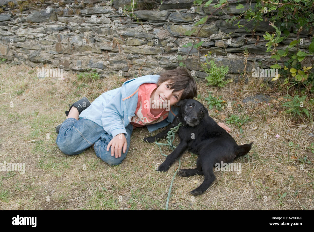 boy cuddling dog Stock Photo - Alamy