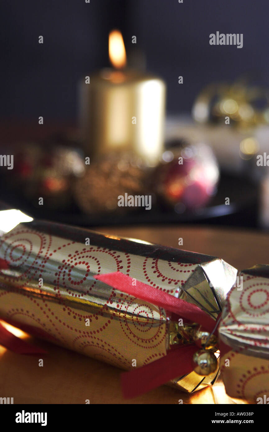 christmas cracker with candle in background Stock Photo - Alamy