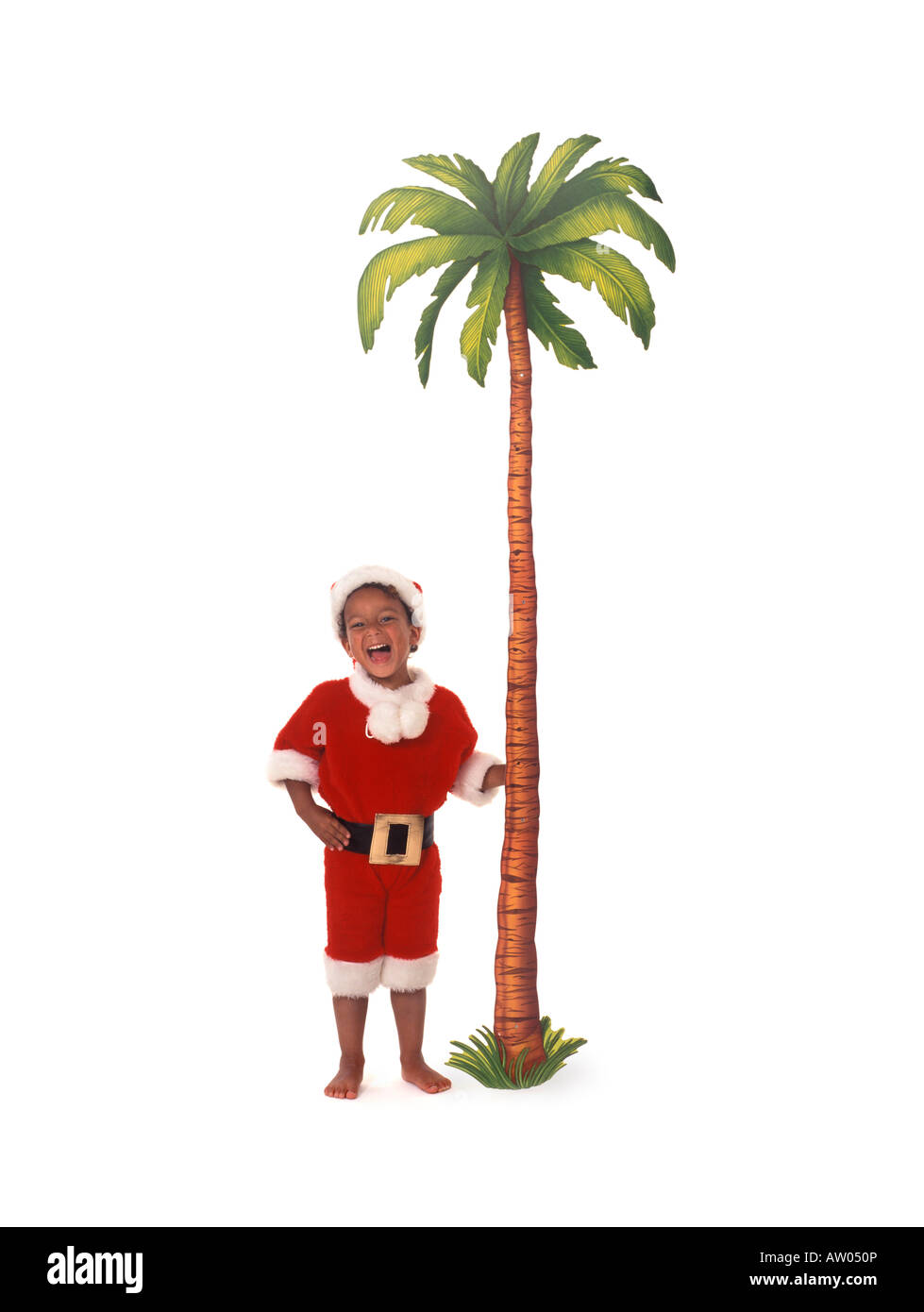 Santa Claus child with a palm tree Stock Photo - Alamy