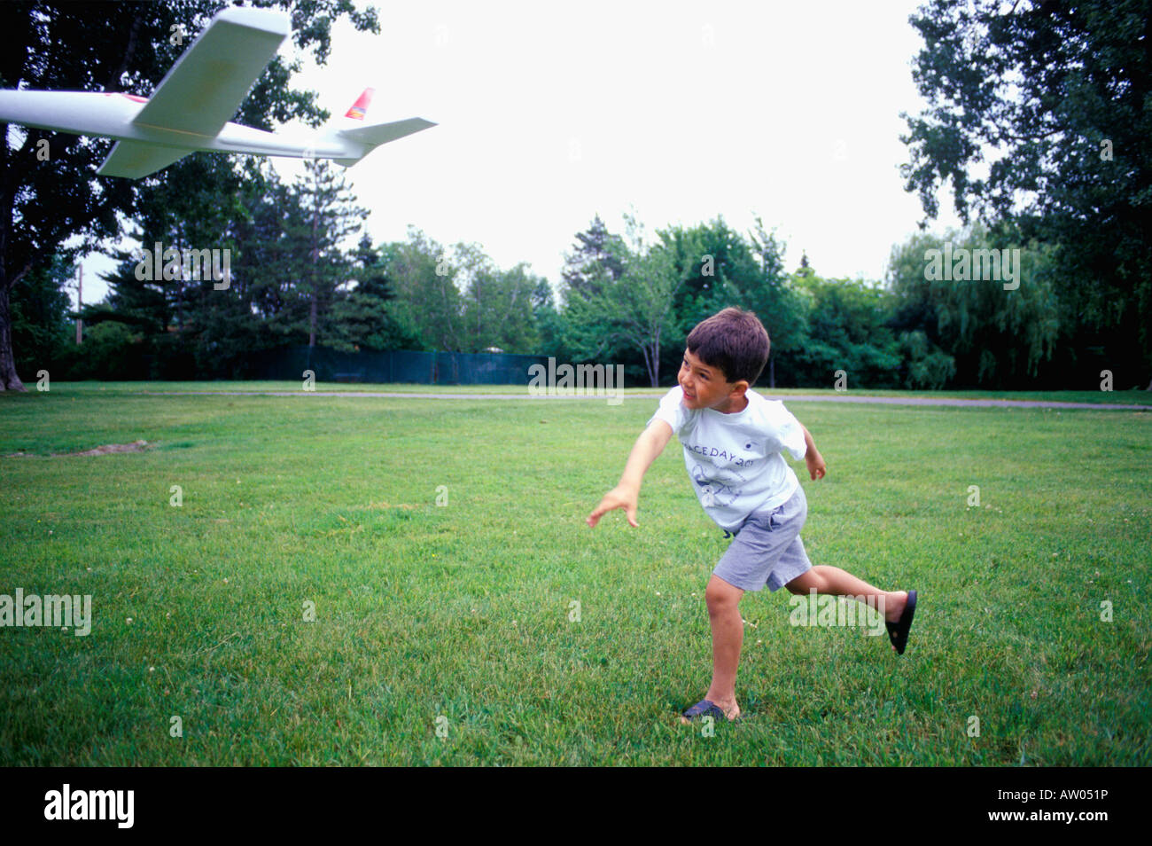 Boy Playing with Toy Airplane Stock Photo - Alamy