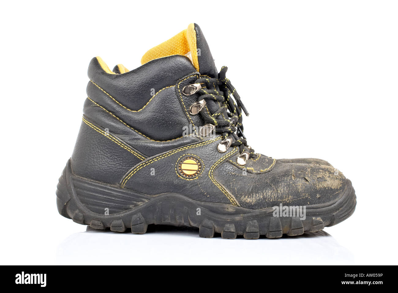 A pair of old work boots reflected on white background Stock Photo - Alamy