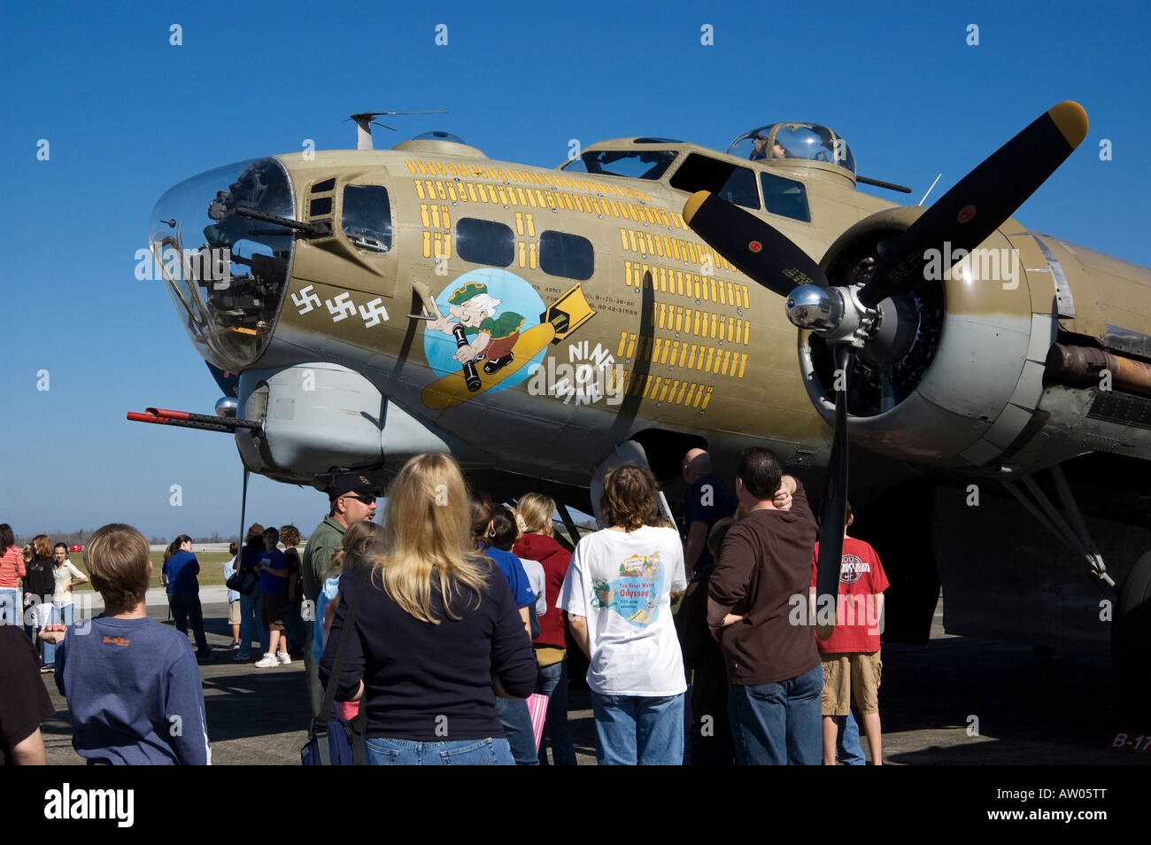 crowd looking at vintage World War 2 bomber B 17 at Wings of Freedom ...