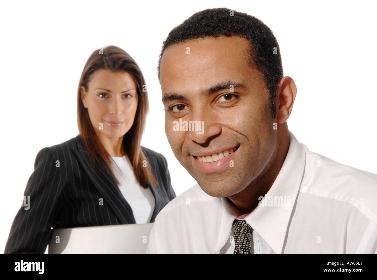 Businessman with team member in the background Stock Photo - Alamy