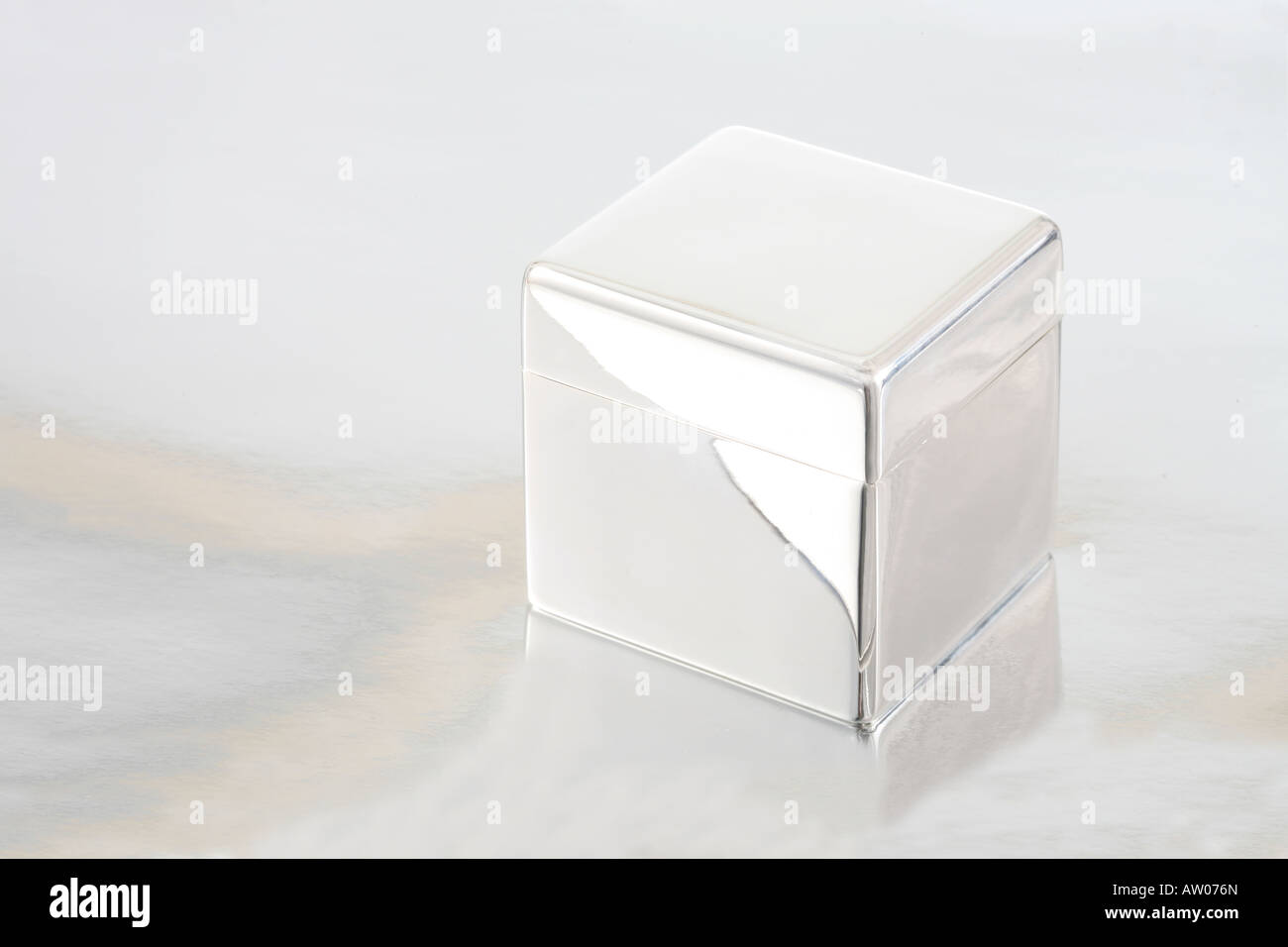 shiny cubic jewelry box on silver background Stock Photo - Alamy