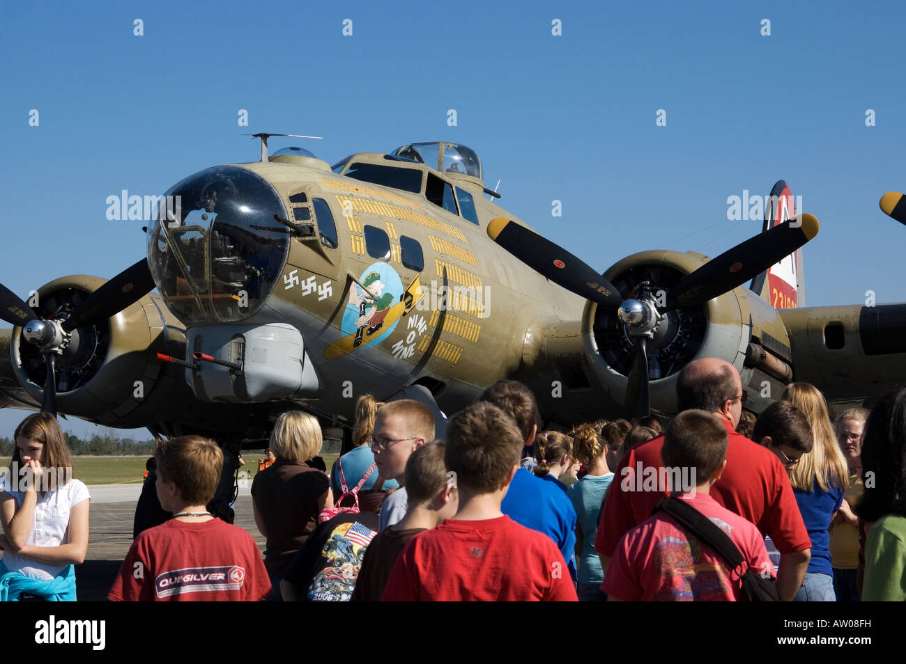 crowd waits to tour through a world war 2 B 17 bomber at Wings of ...