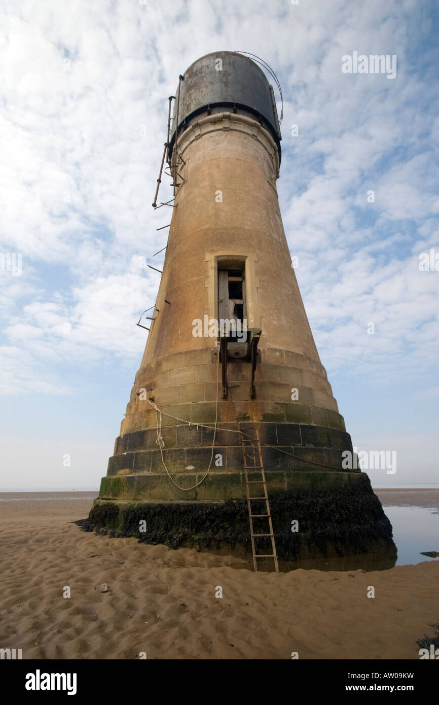 Wide angle view of an old derelict lighthouse at Spurn Point on the ...