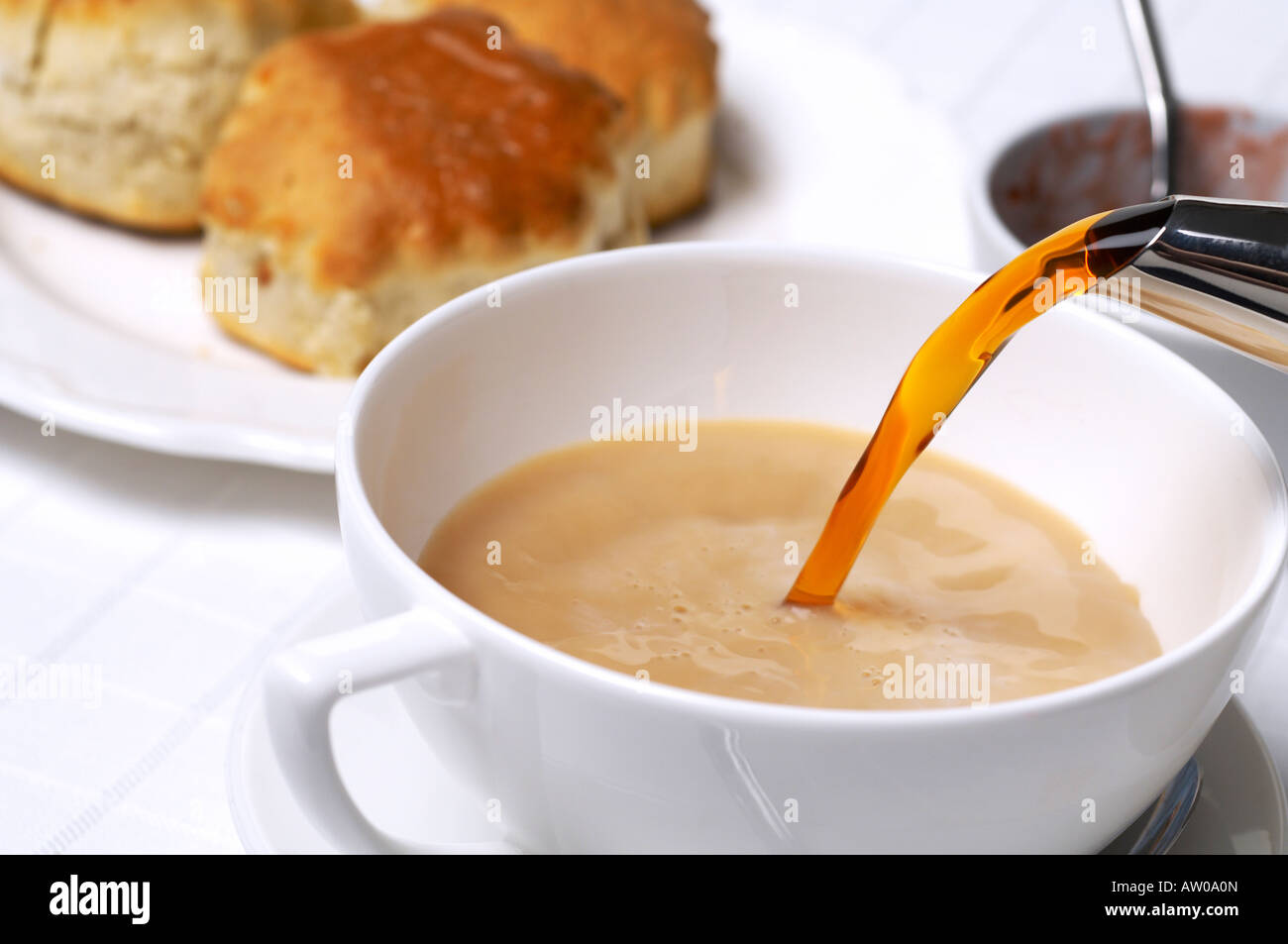 Pouring cup of tea Stock Photo - Alamy