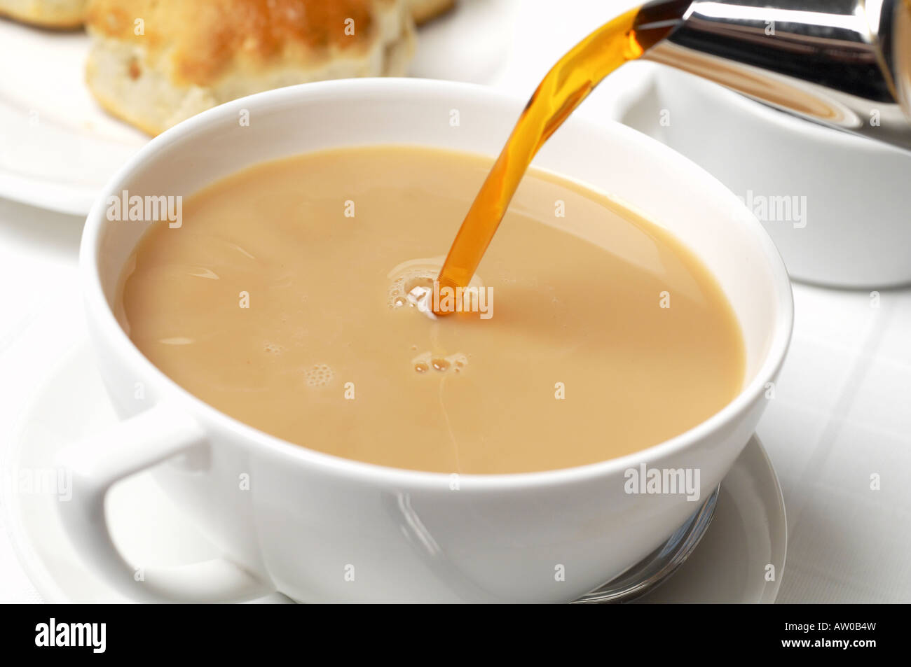 Pouring cup of tea Stock Photo - Alamy