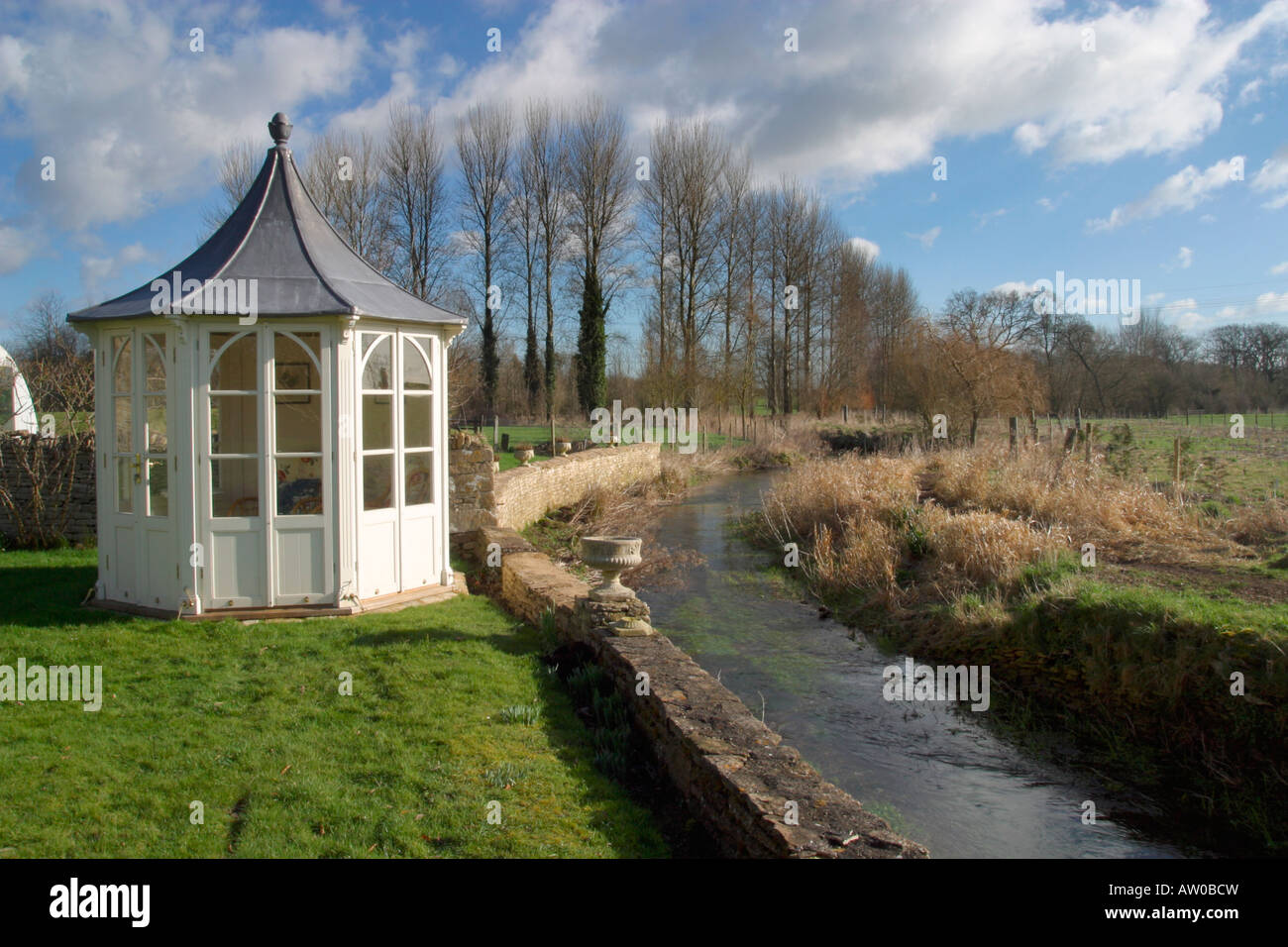 Riverside summerhouse in spring Stock Photo - Alamy