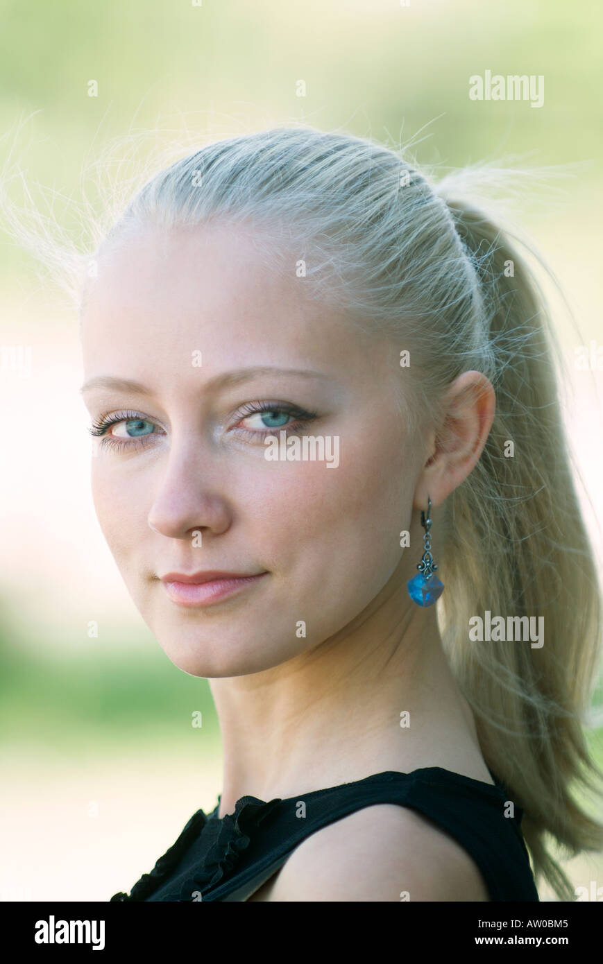 portrait of self confident woman with ponytail Stock Photo - Alamy