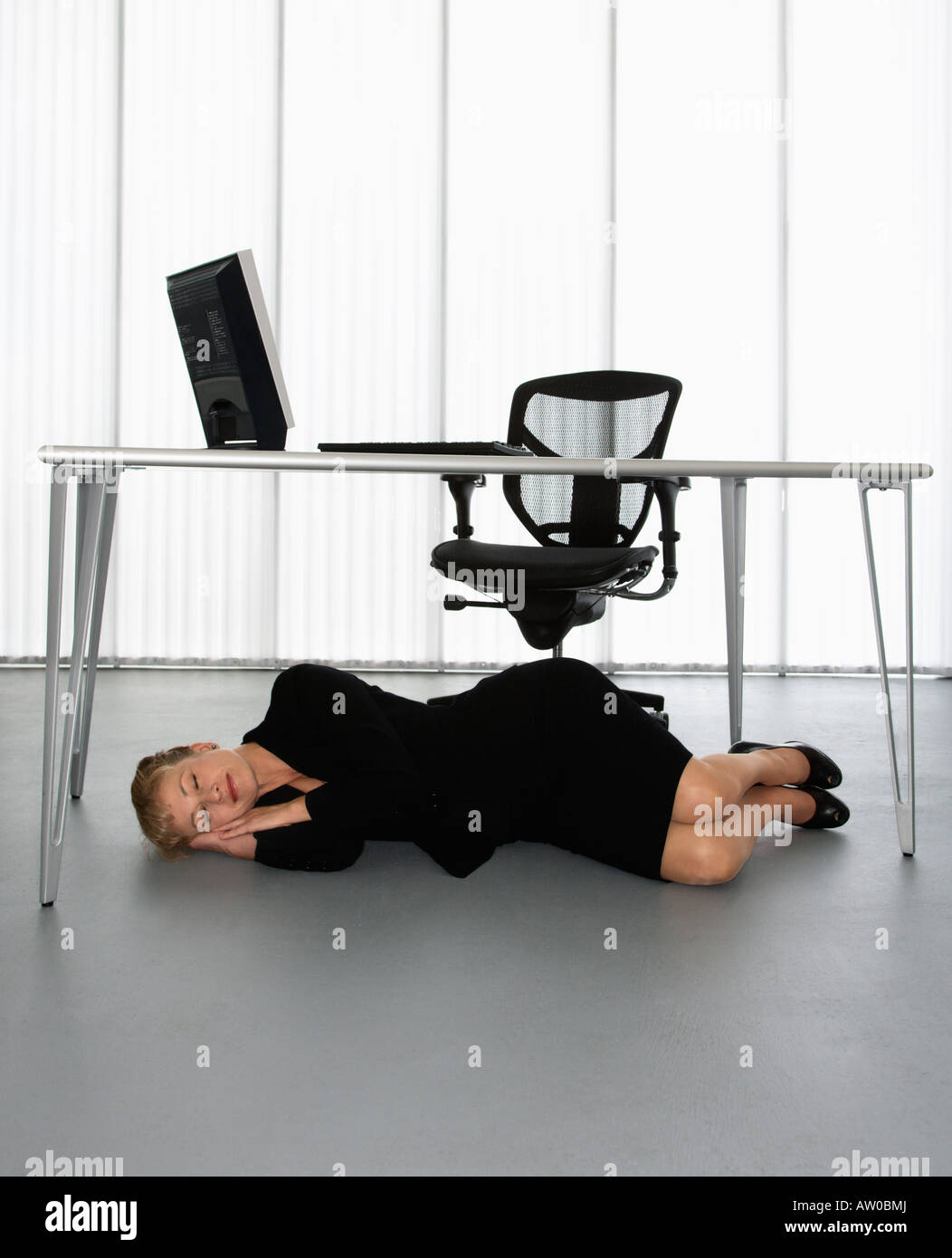 Tired businesswoman sleeping office floor hi-res stock photography and ...