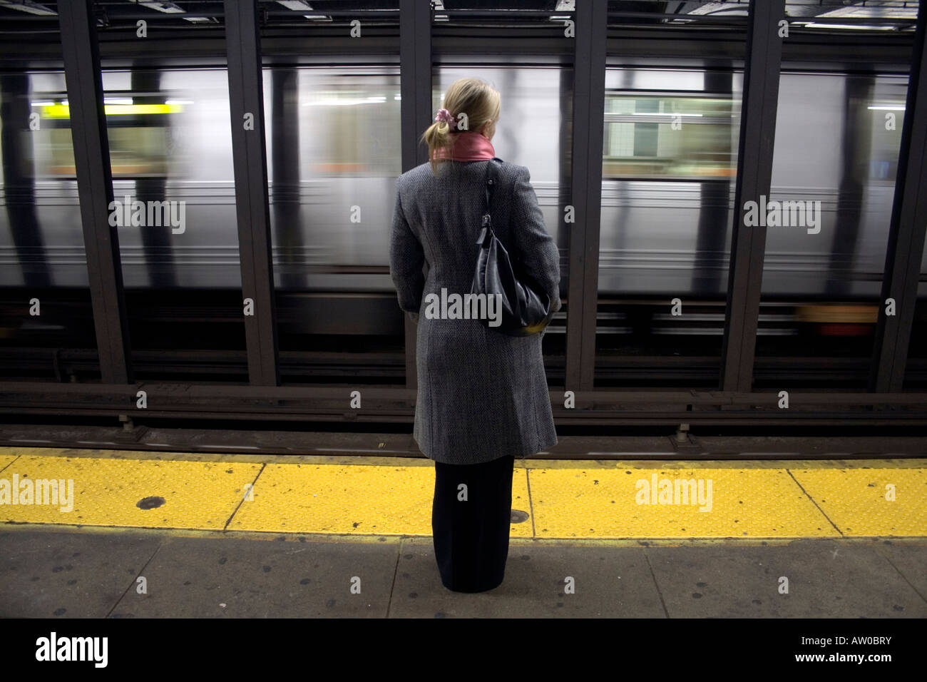 Woman waiting for train. Shot from one of NYC Subway stations Stock ...