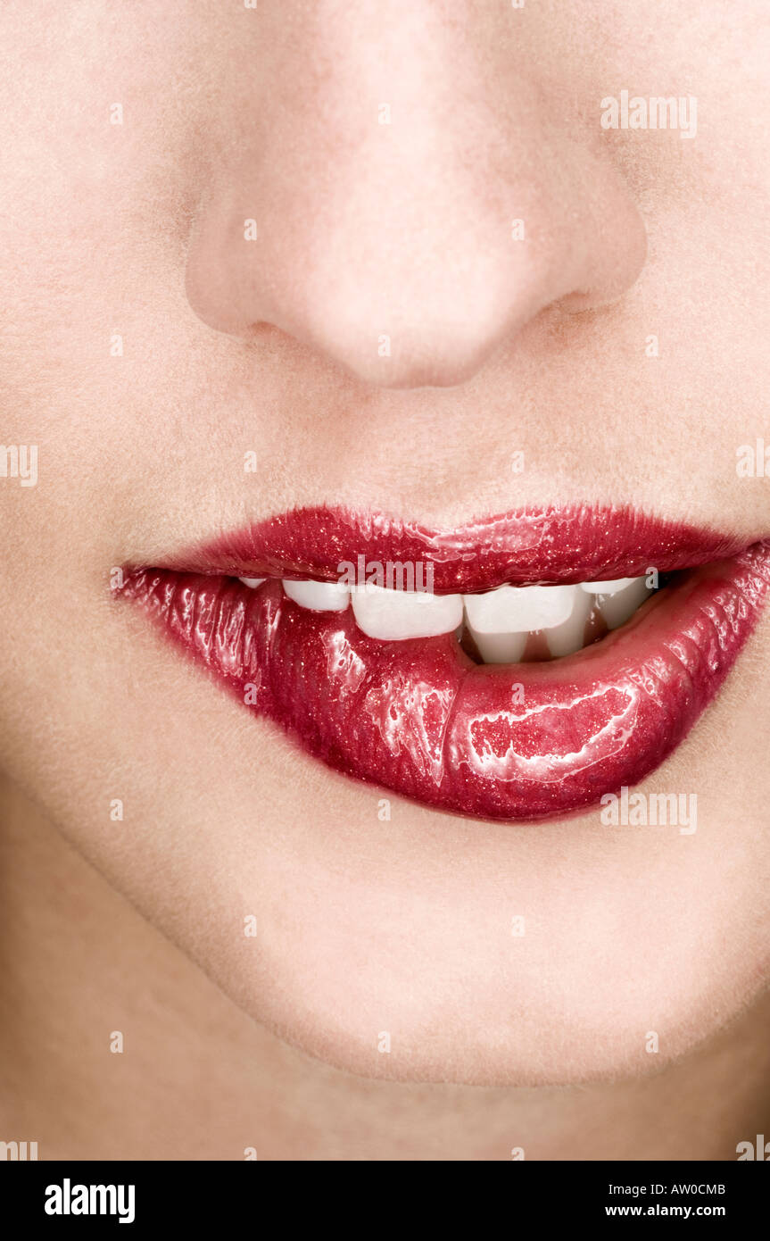 Close up biting mouth red lipstick hi-res stock photography and images ...