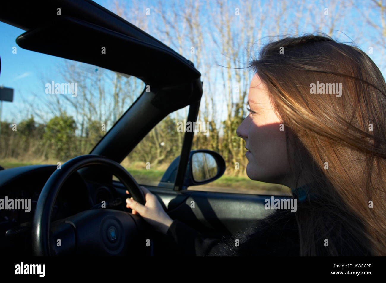 Pretty woman driving a convertable car Stock Photo - Alamy