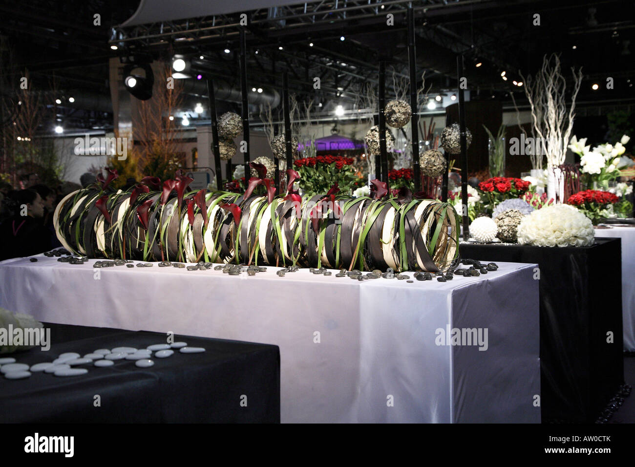 Rows of long narrow tables on raised dais with different kinds of ...