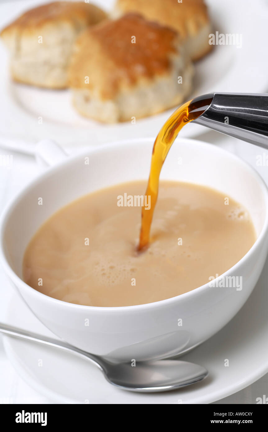 Pouring cup of tea Stock Photo - Alamy