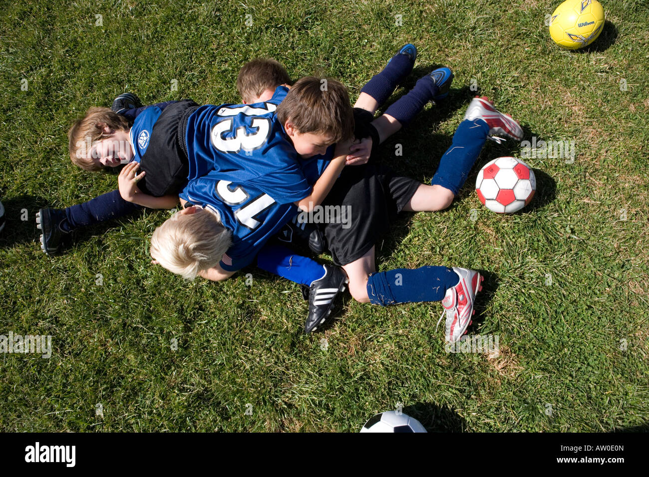 six year old soccer players piling on eachother after game Stock Photo ...