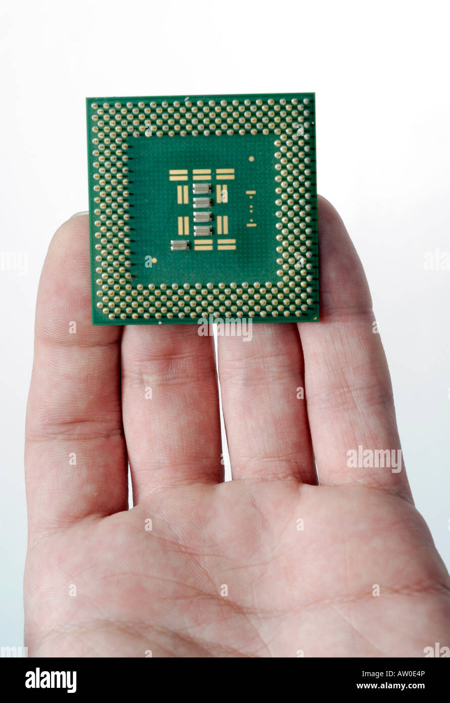 Computer processor detail close up in man hand Stock Photo - Alamy