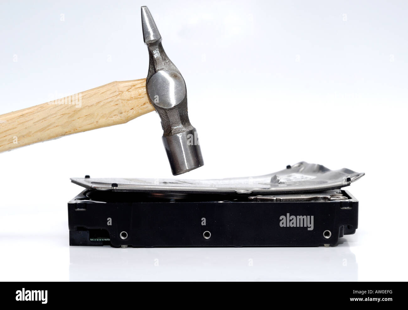 Smashing hard disc drive with hammer Stock Photo - Alamy