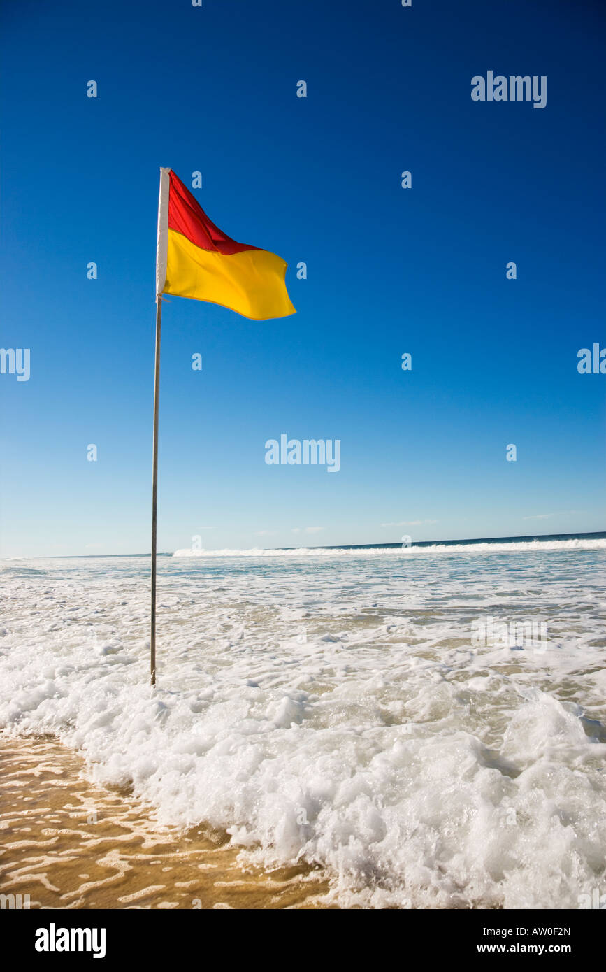 Flag on beach Stock Photo - Alamy